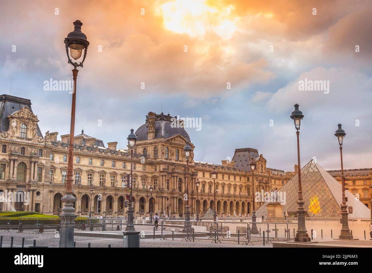 Louvre Street lights from Tuileries and dramatic sky, Paris, France ...
