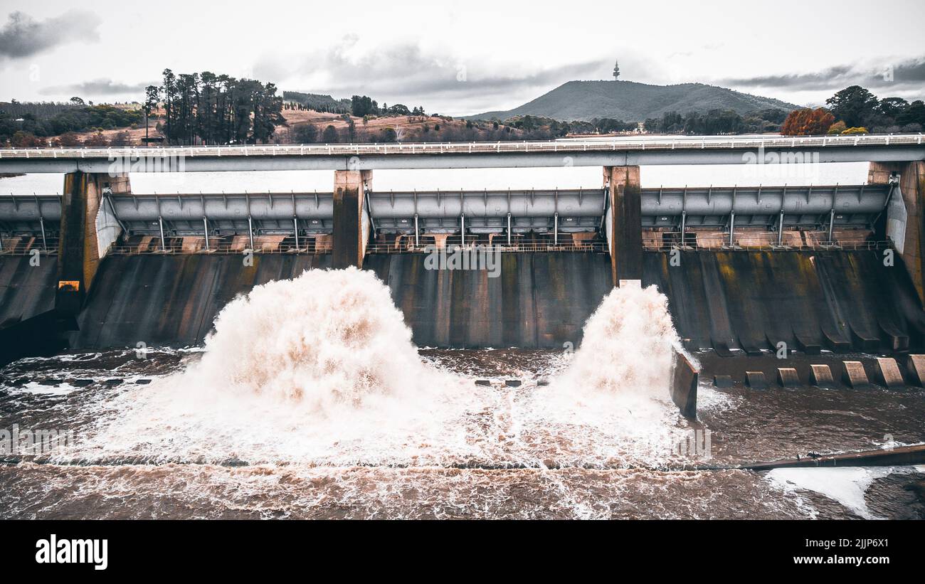A dam in the countryside under the cloudy rainy sky Stock Photo - Alamy