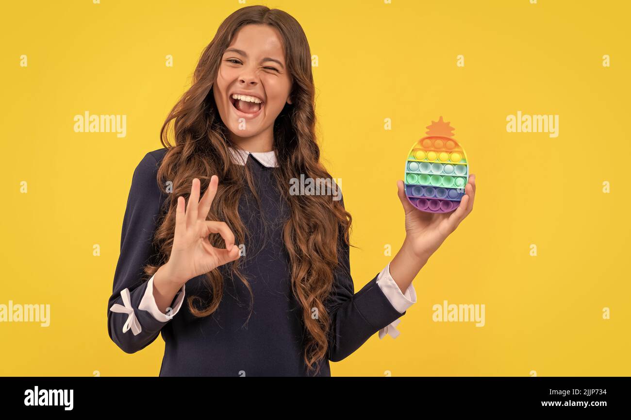 happy winking child with pop it silicone sensory fidget game show ok ...