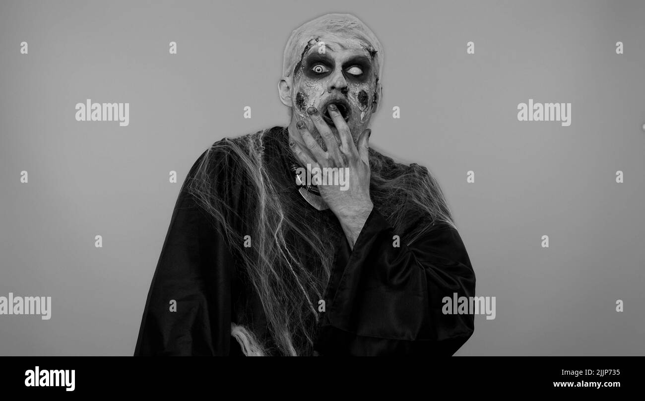 Oh my God, Wow. Frightening man with Halloween zombie bloody wounded ...