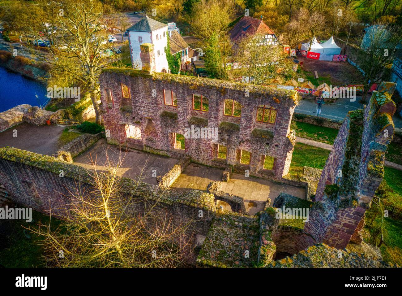 An aerial drone view of the Burg Hayn castle ruin in Dreieich, Germany ...