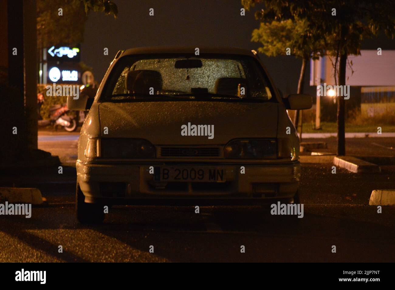 A view of parked Ford Sierra classic street car at night Stock Photo ...