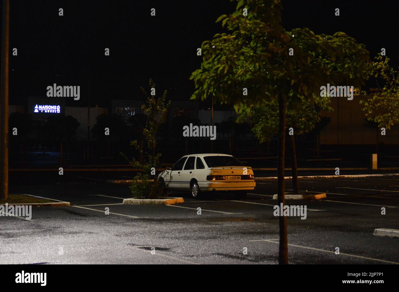A view of parked Ford Sierra classic street car at night Stock Photo ...