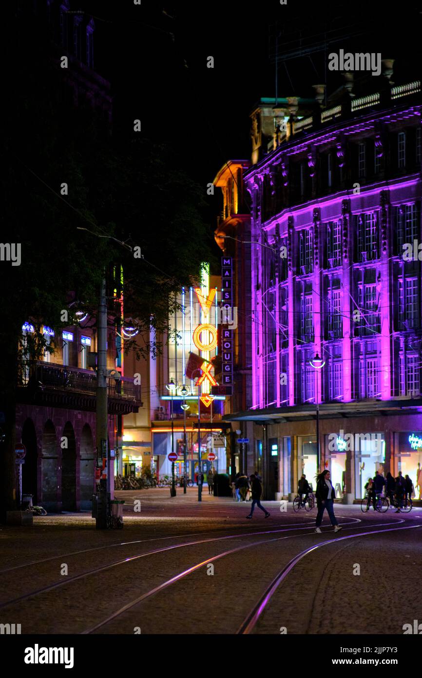 A vertical shot of cityscape with railways at night in Strasbourg city ...