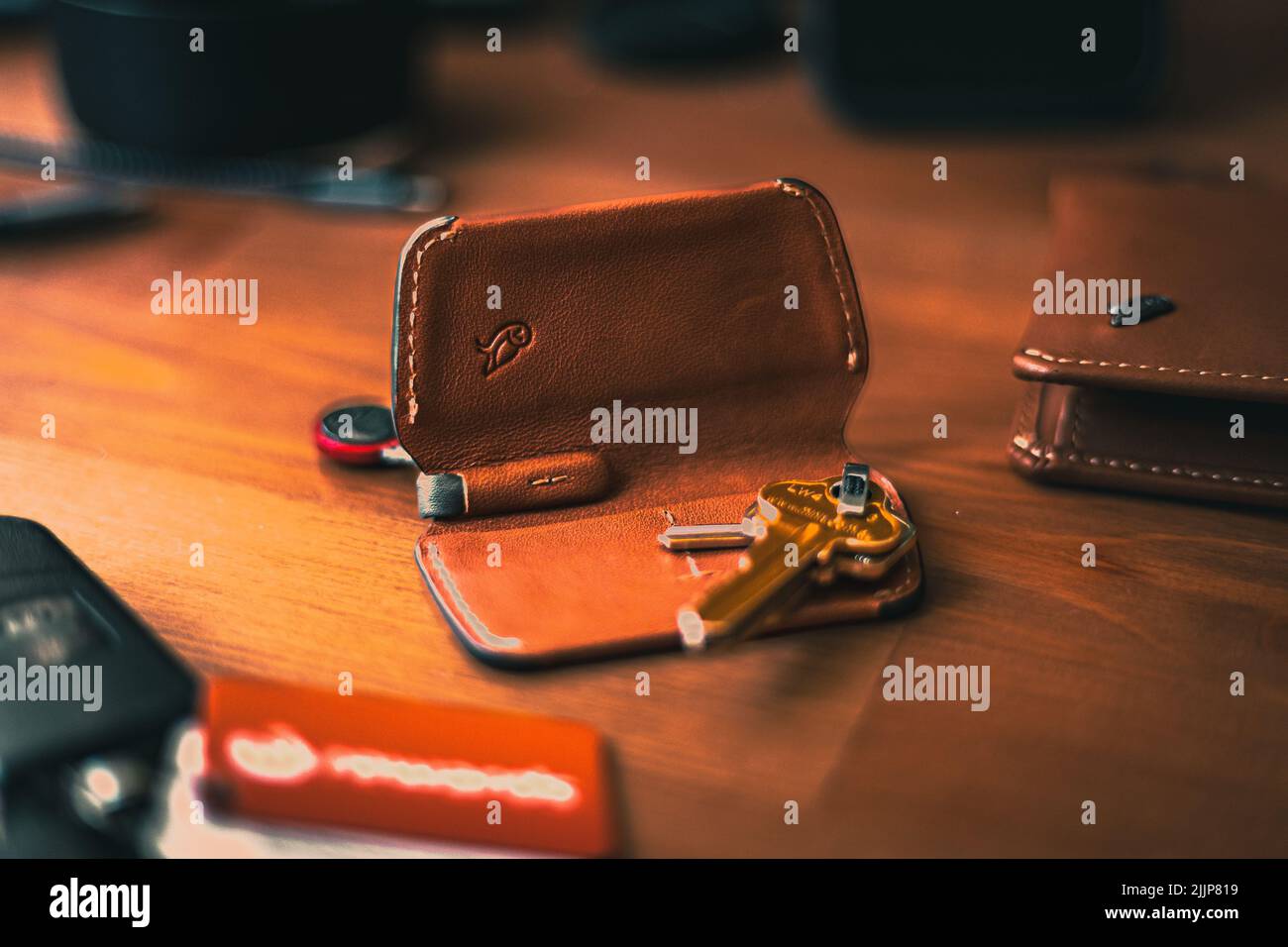 a close up shot of Product photography of Bellroy key holder on wooden ...