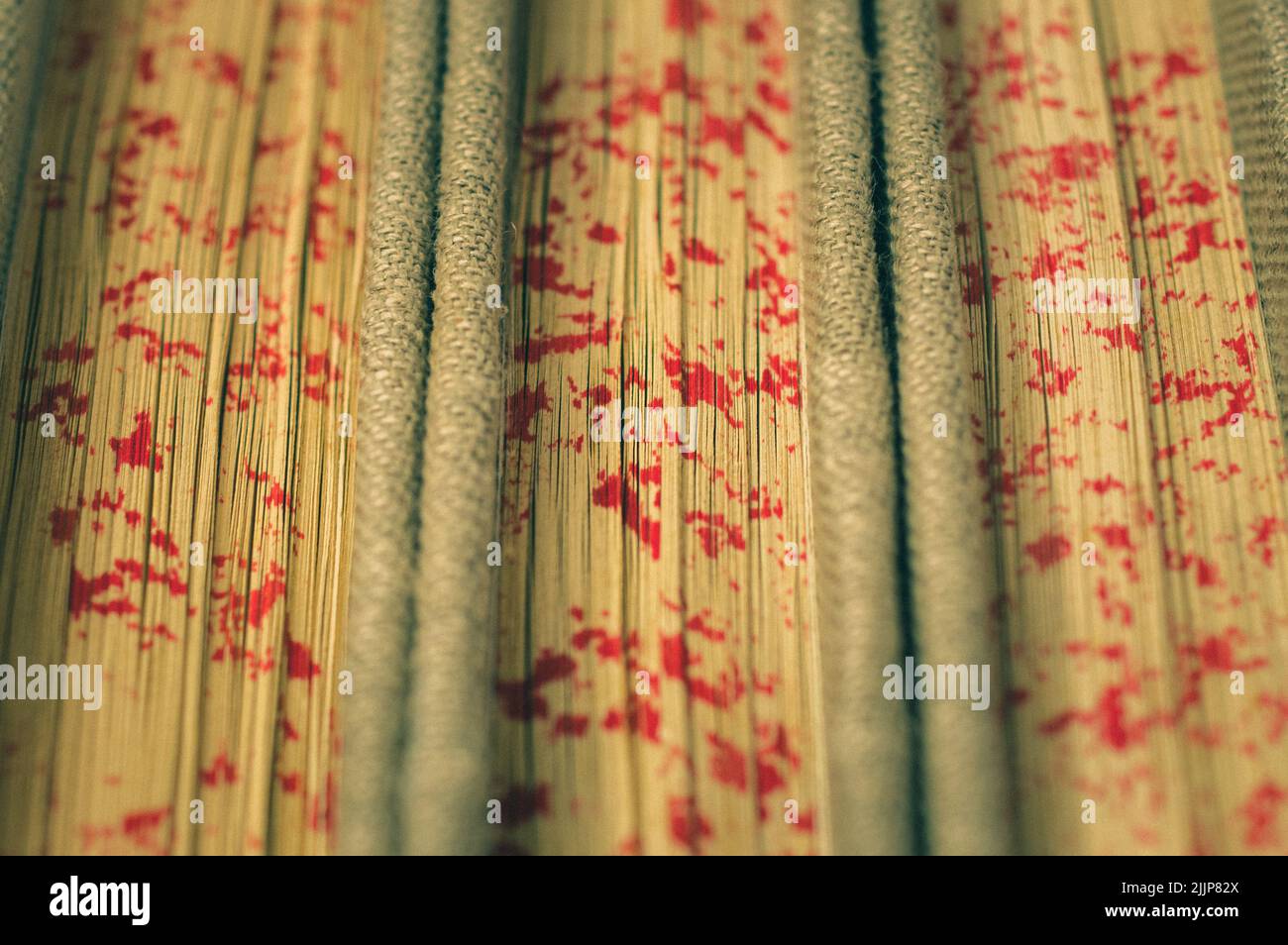 A top view of splashes of red paints on old books side by side Stock ...