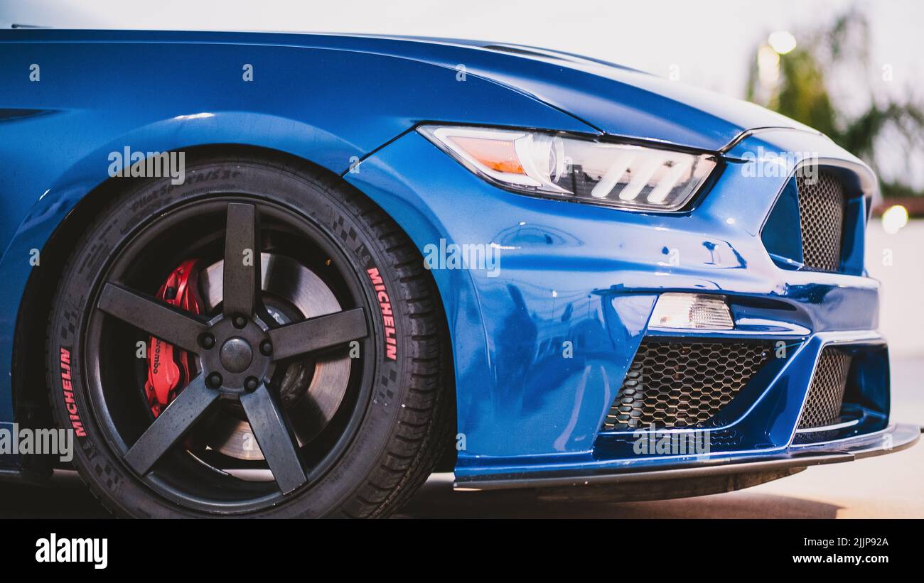 A close up of a blue car parked in public mall in Santa Ana Stock Photo ...