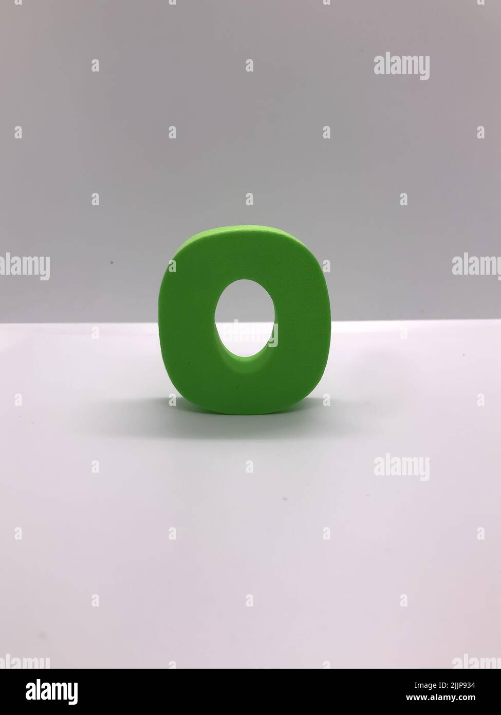 A green number 0 figure isolated on white background Stock Photo - Alamy