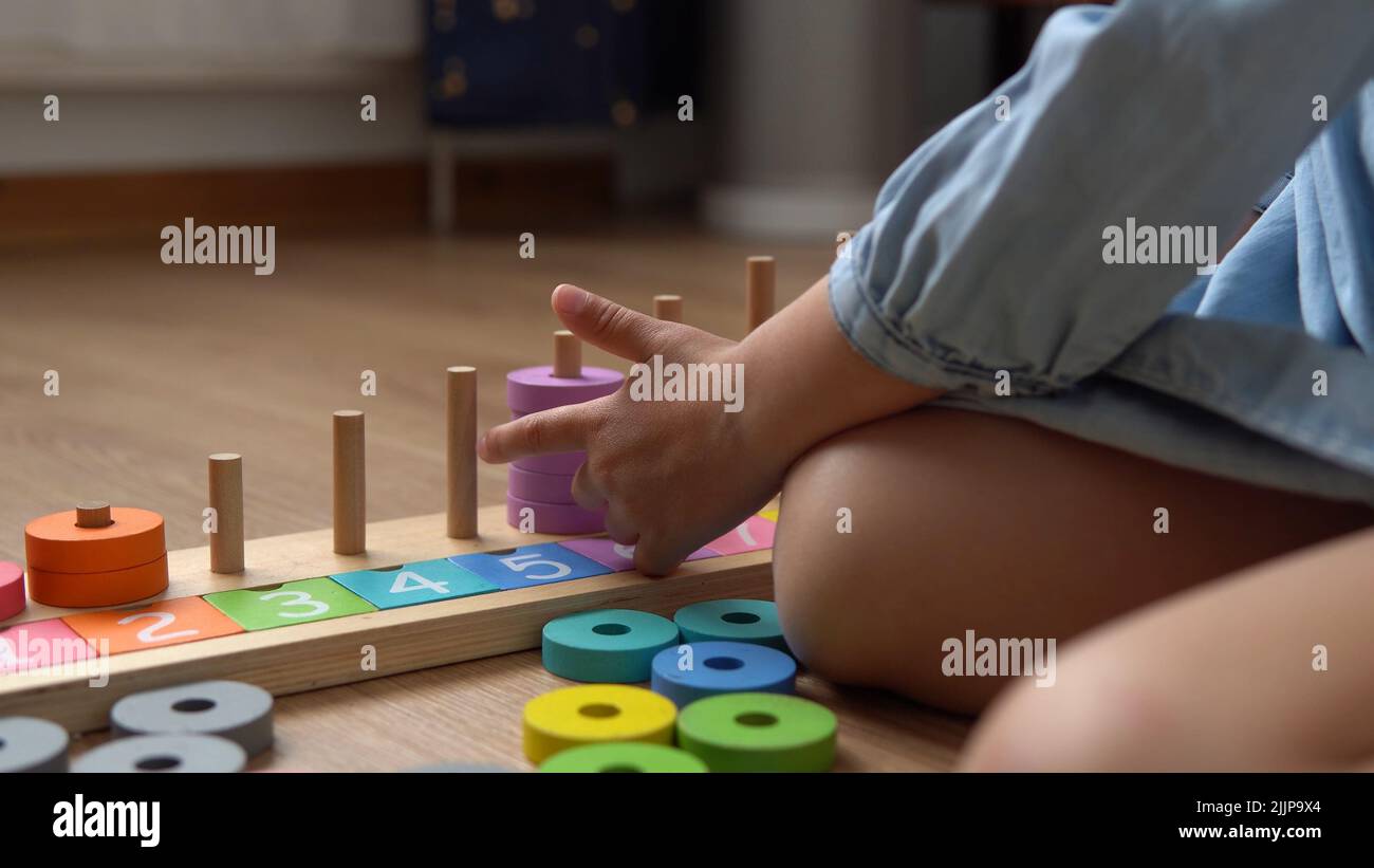 Happy Little Preschool Toothless Girl Playing With Colored Wooden Toy ...