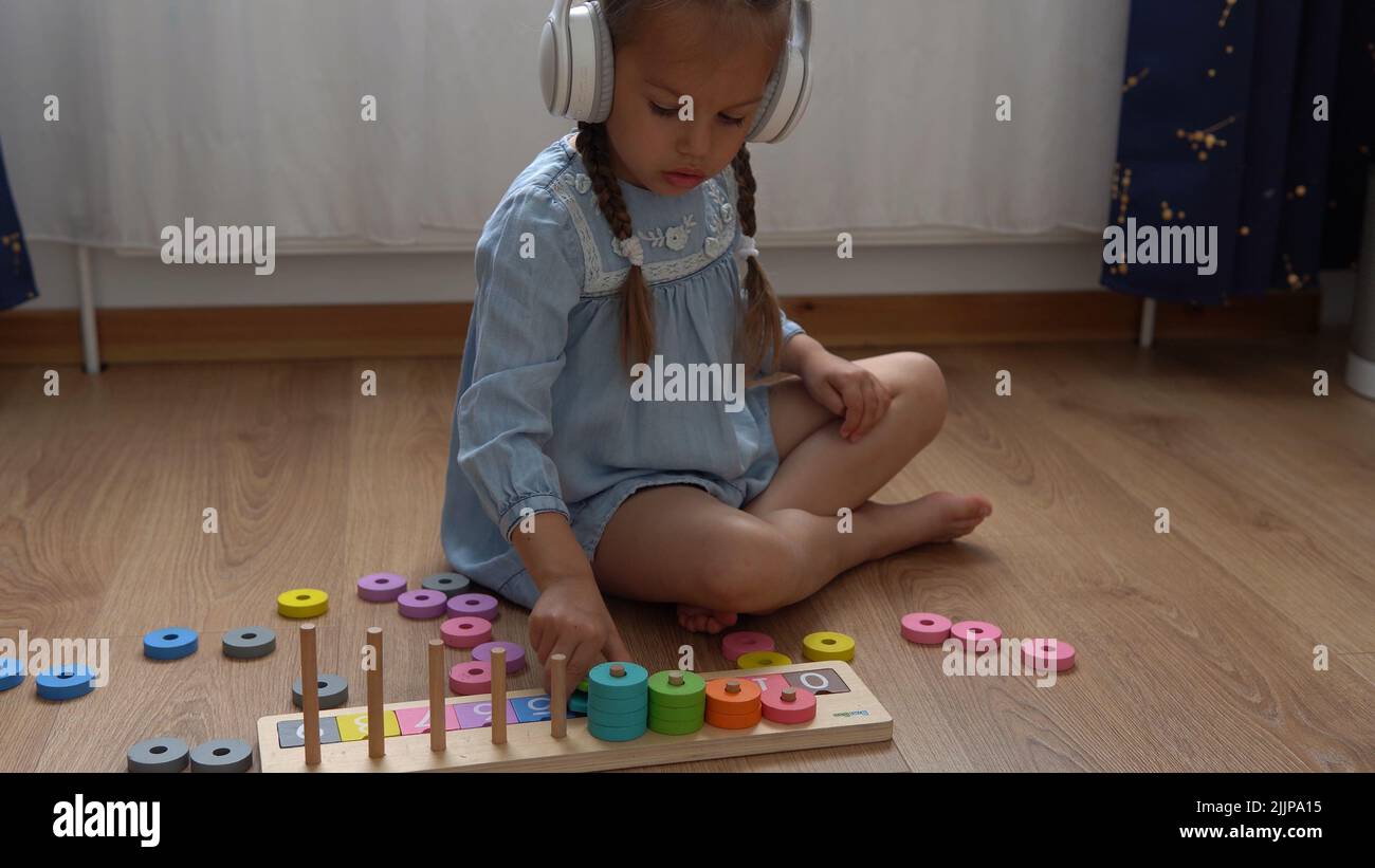 Happy Little Preschool Toothless Girl Playing With Colored Wooden Toy ...