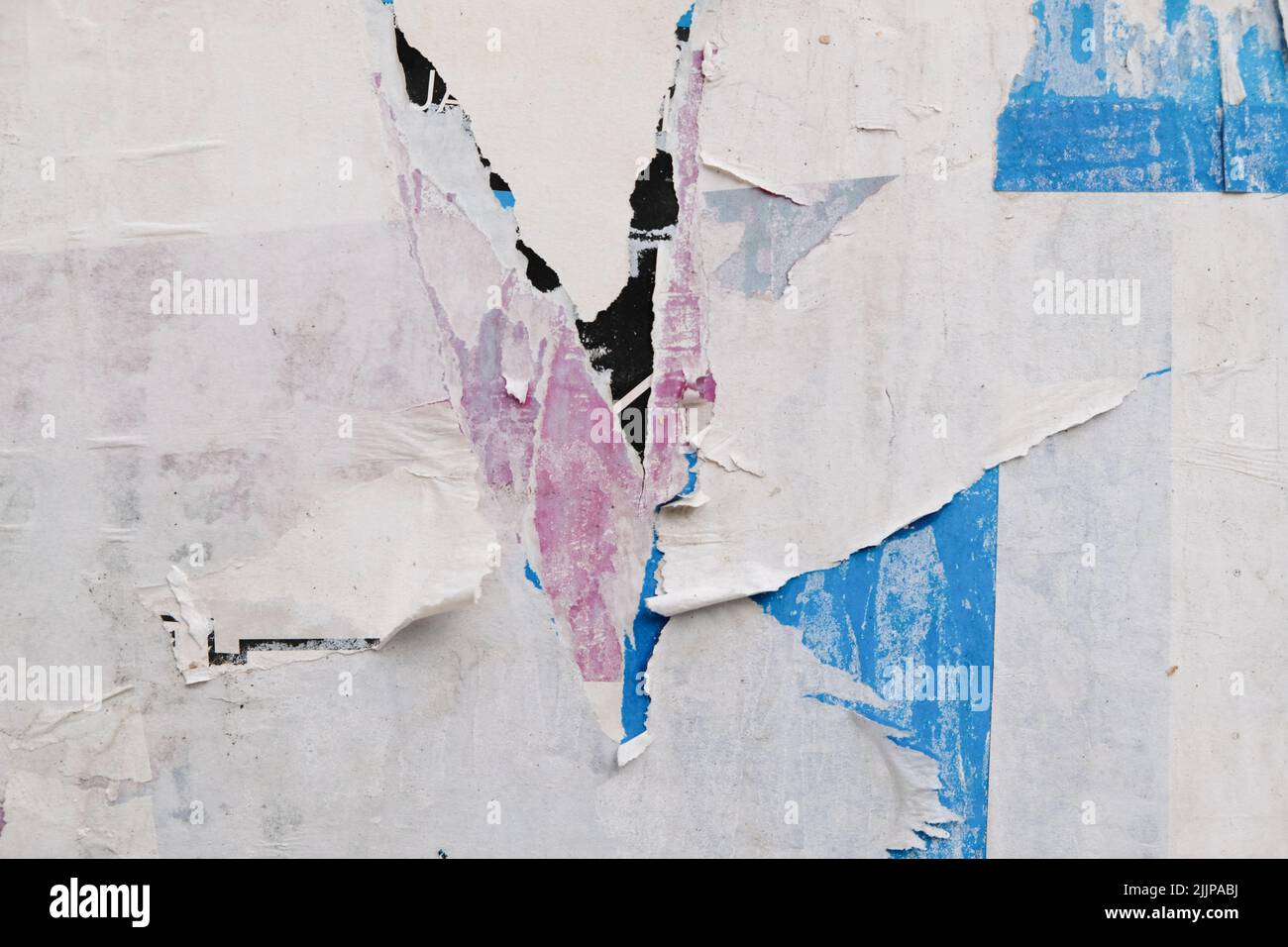 Torn posters on billboard hi-res stock photography and images - Alamy