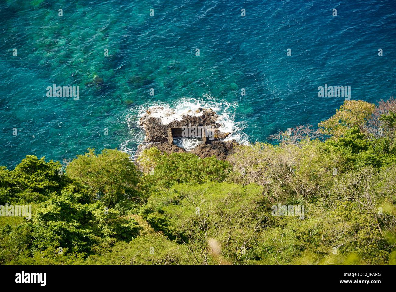 A top view of cliff looking to the azure water Stock Photo - Alamy