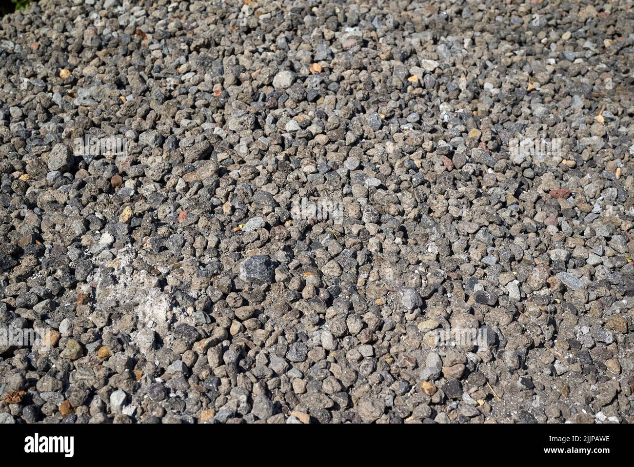 A closeup of small grey stone texture ground under sunlight Stock Photo ...