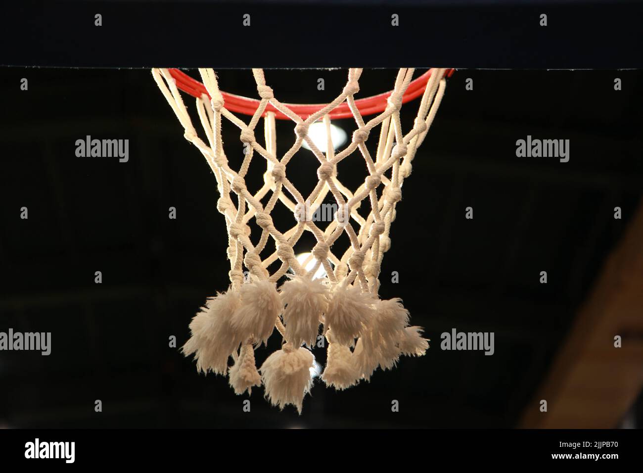 A close-up shot of a basketball net in the dark Stock Photo - Alamy