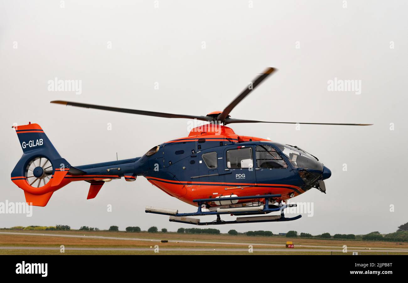 Cornwall, England, UK. 2022. A modern helicopter in flight with covered ...