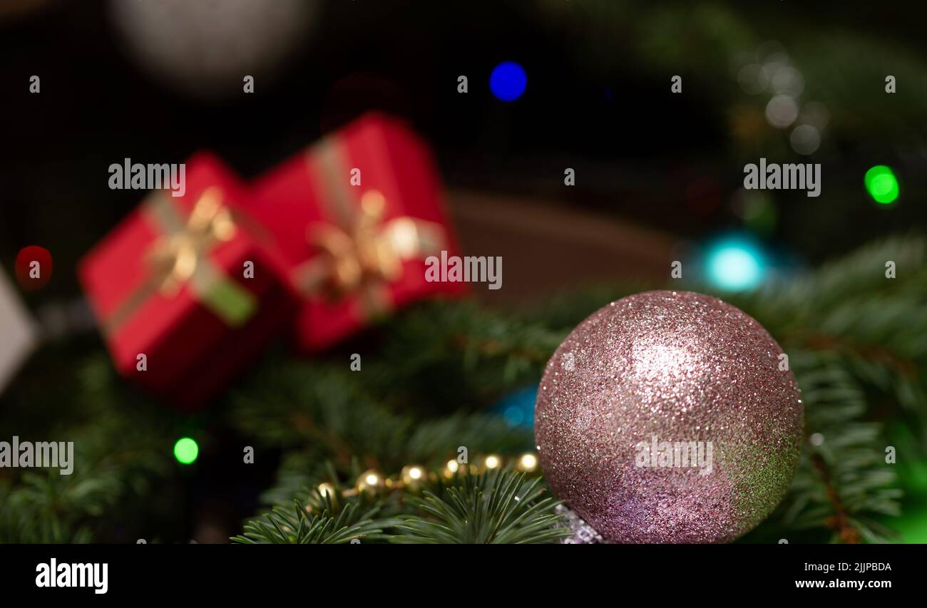 Small gift boxes with bows. Christmas tree decorations. Christmas Eve ...