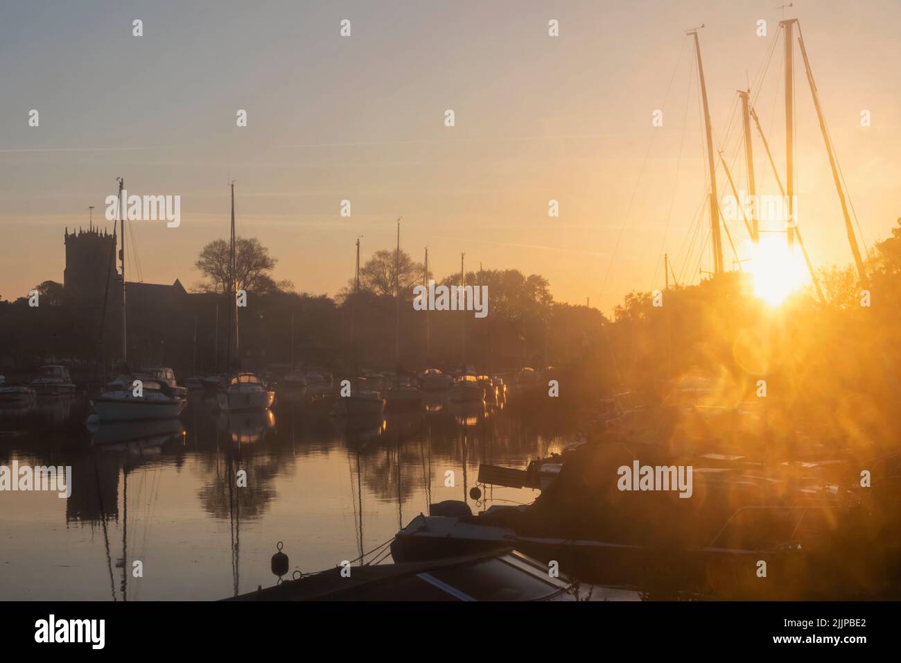 England, Dorset, Christchurch, Town Skyline and River Stour at Dawn ...