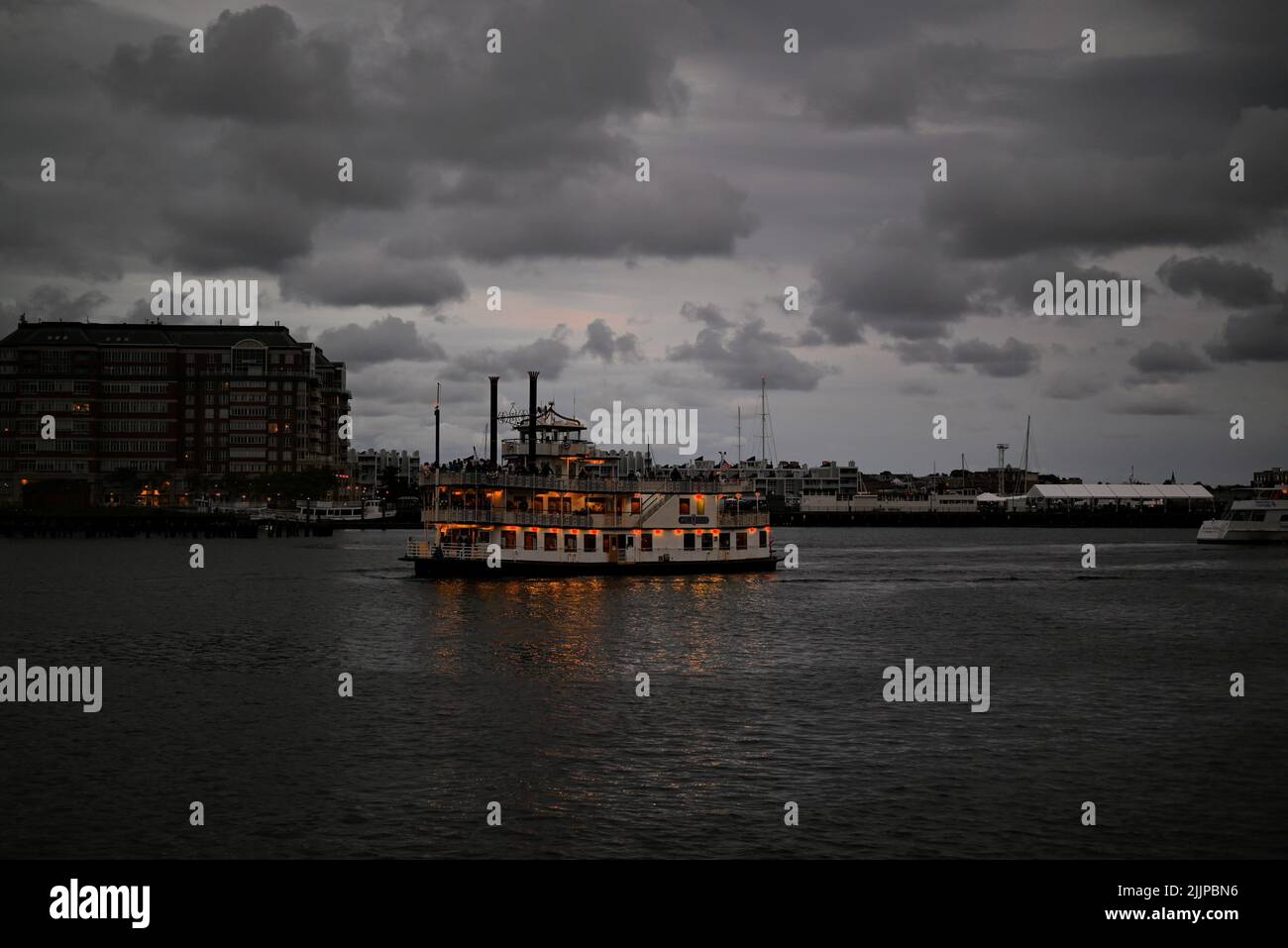 A beautiful scene of seaboats in reflecting light seawater against a ...
