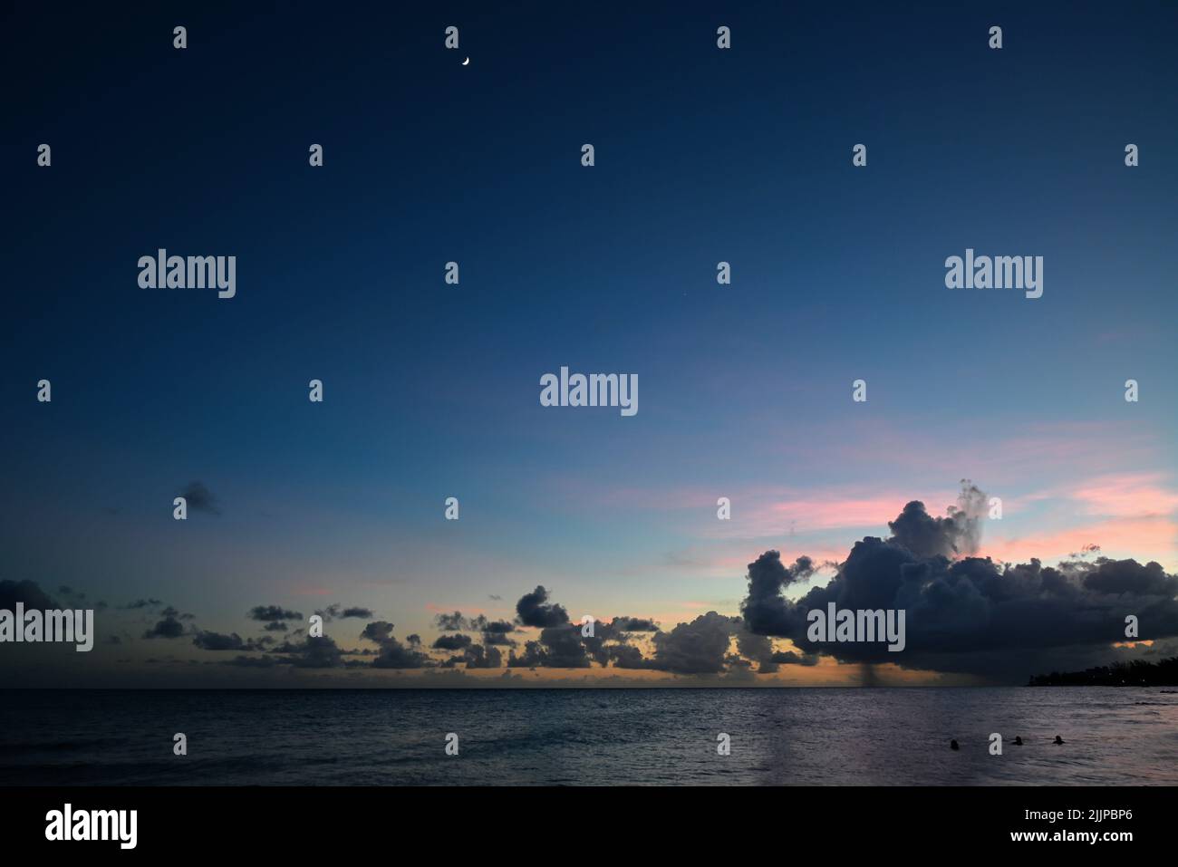A beautiful scene of large water gray sea with dramatic clouds in the ...