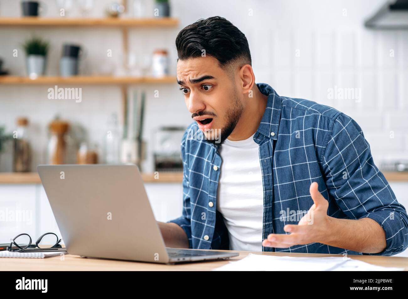 Confused student looking laptop screen hi-res stock photography and ...
