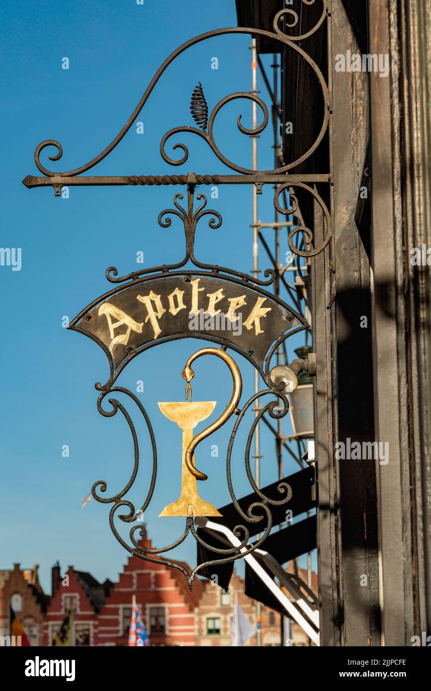 An old historical pharmacy sign in a high street in Brugge, Belgium ...