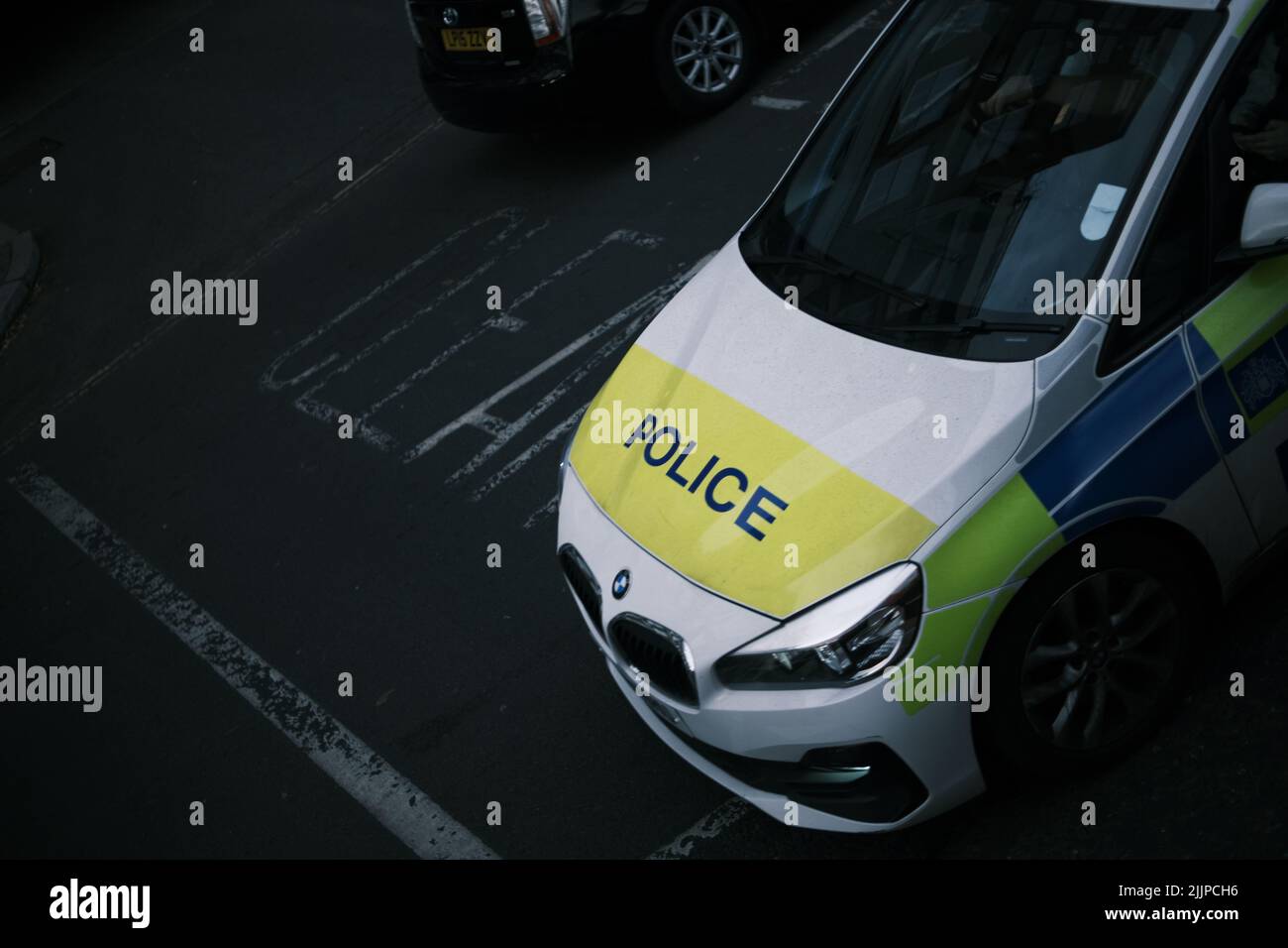 Police car parked on street hi-res stock photography and images - Alamy