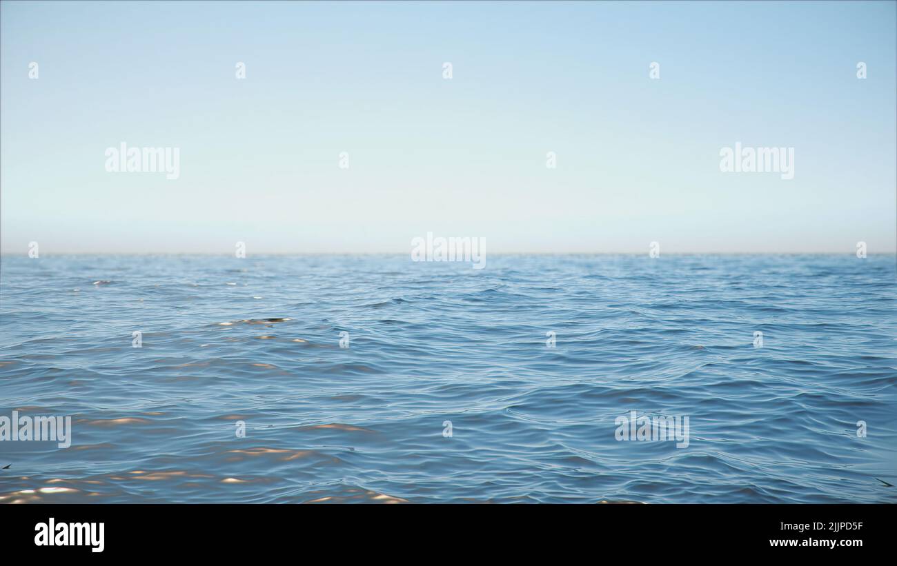 A scenic view of a blue wavy sea with a sunlight on it Stock Photo - Alamy
