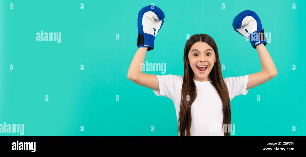 happy kid boxer celebrate victory in boxing gloves during sport ...