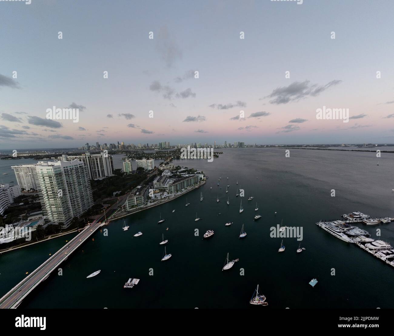 An aerial view of the Miami waterfront with berthed boats at sunrise ...