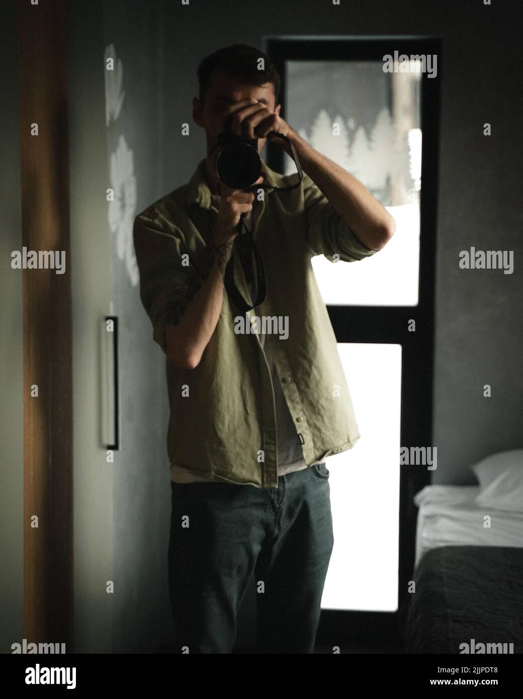 A beautiful shot of a man taking a photo with a camera Stock Photo - Alamy