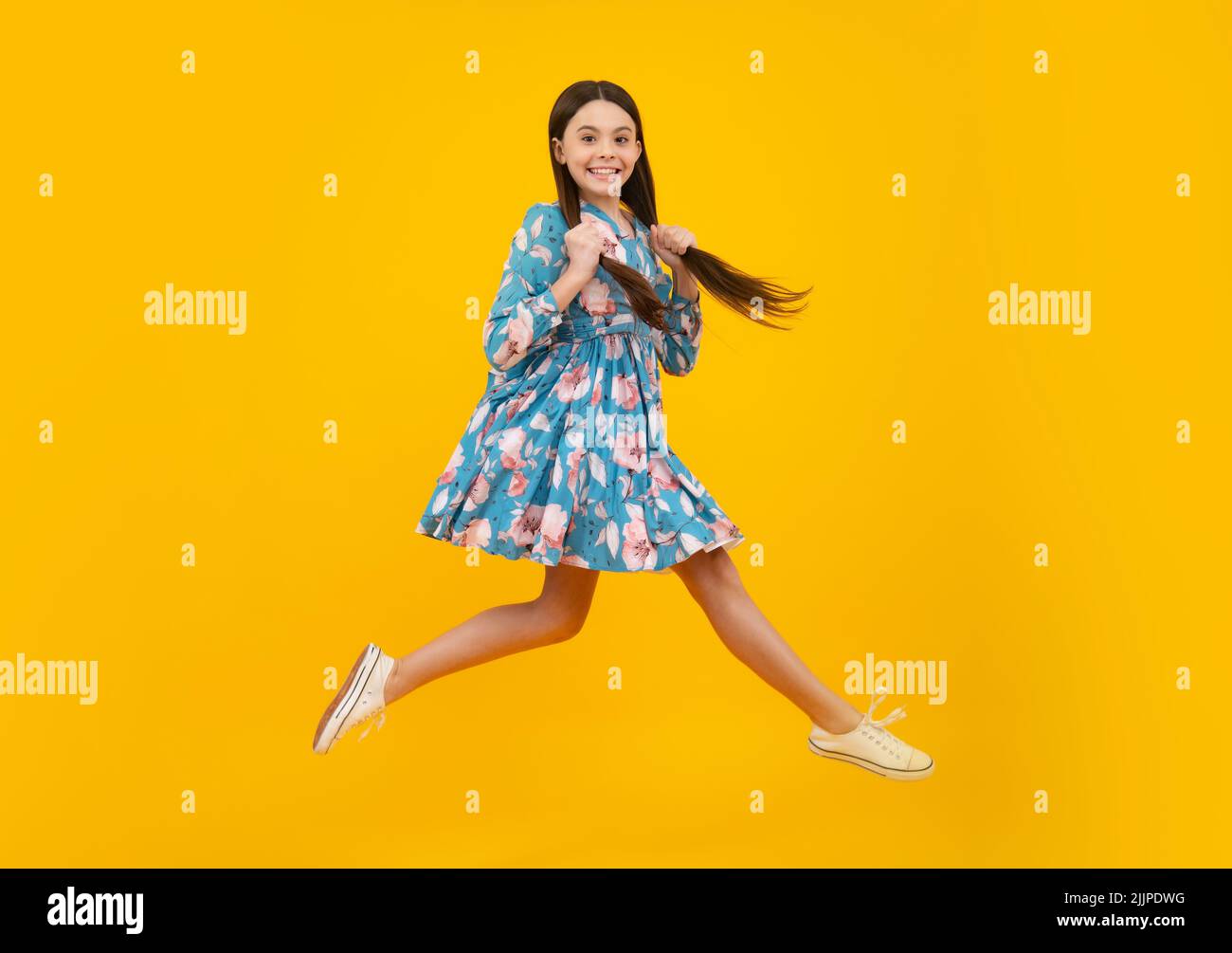 Happiness, activity and child. Teenager girl jumping on isolated ...