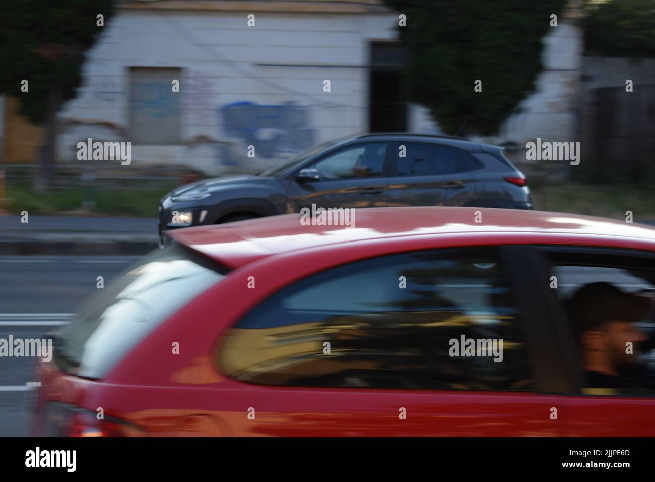Cars ride on summer street hi-res stock photography and images - Alamy