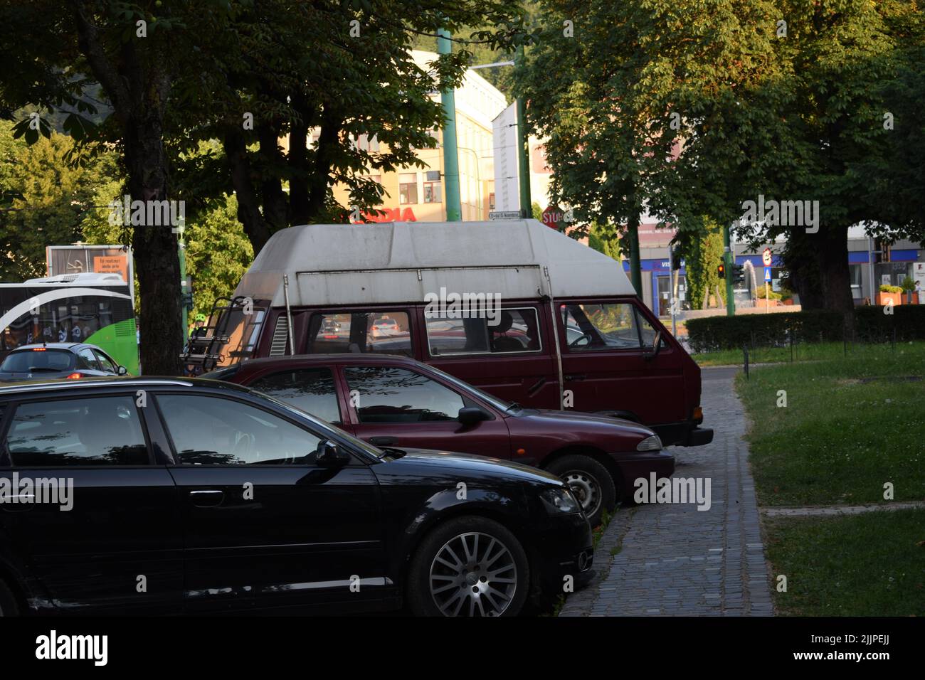 A daylight shot of cars on the street in Brasov, Romania in the summer ...