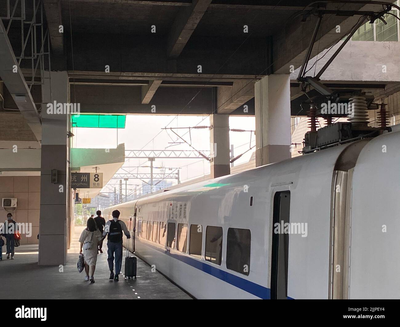 An ancient railway station and a highspeed train in China Stock Photo ...