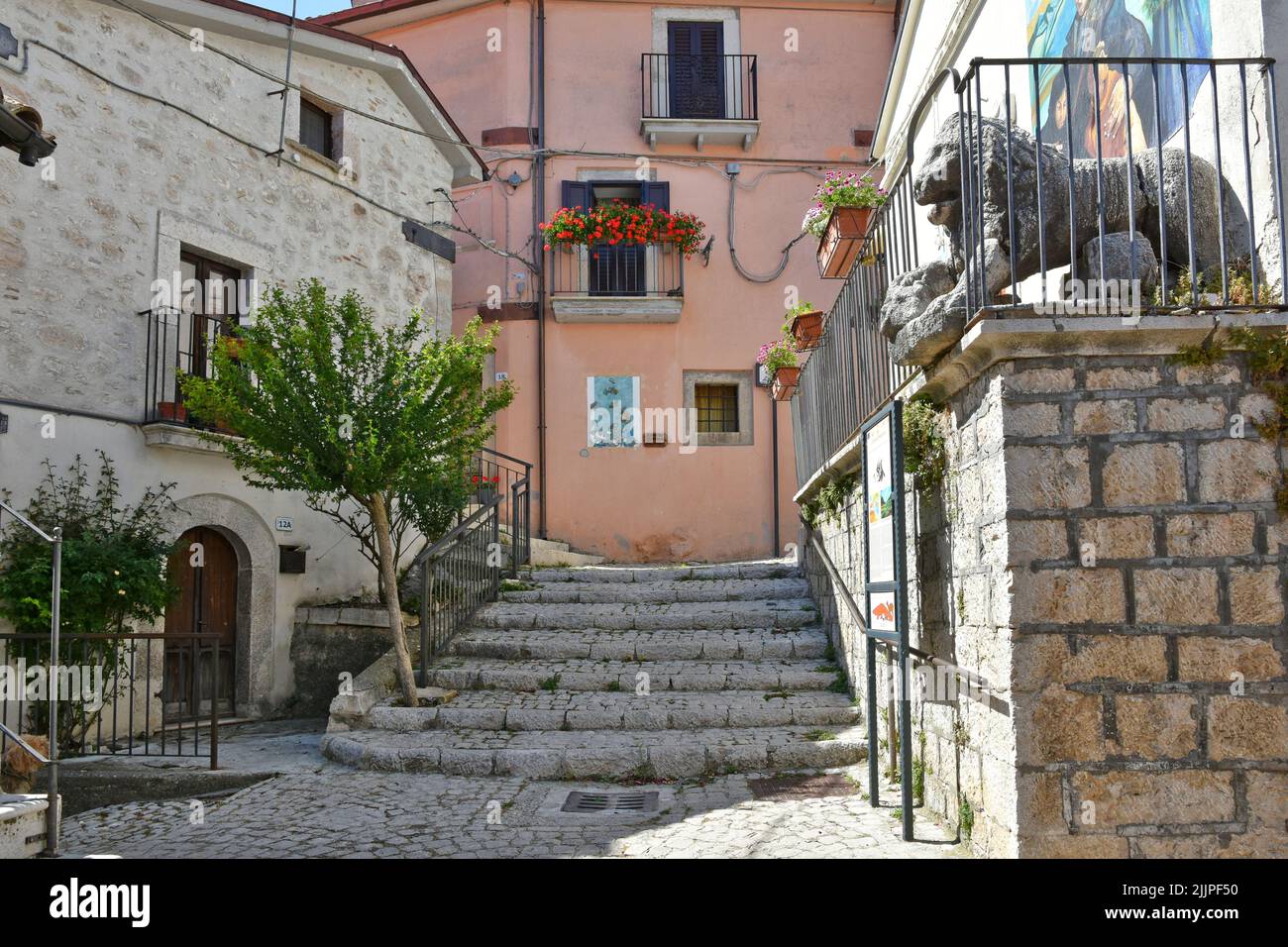 A staircase in narrow street among the old stone houses of Scontrone ...