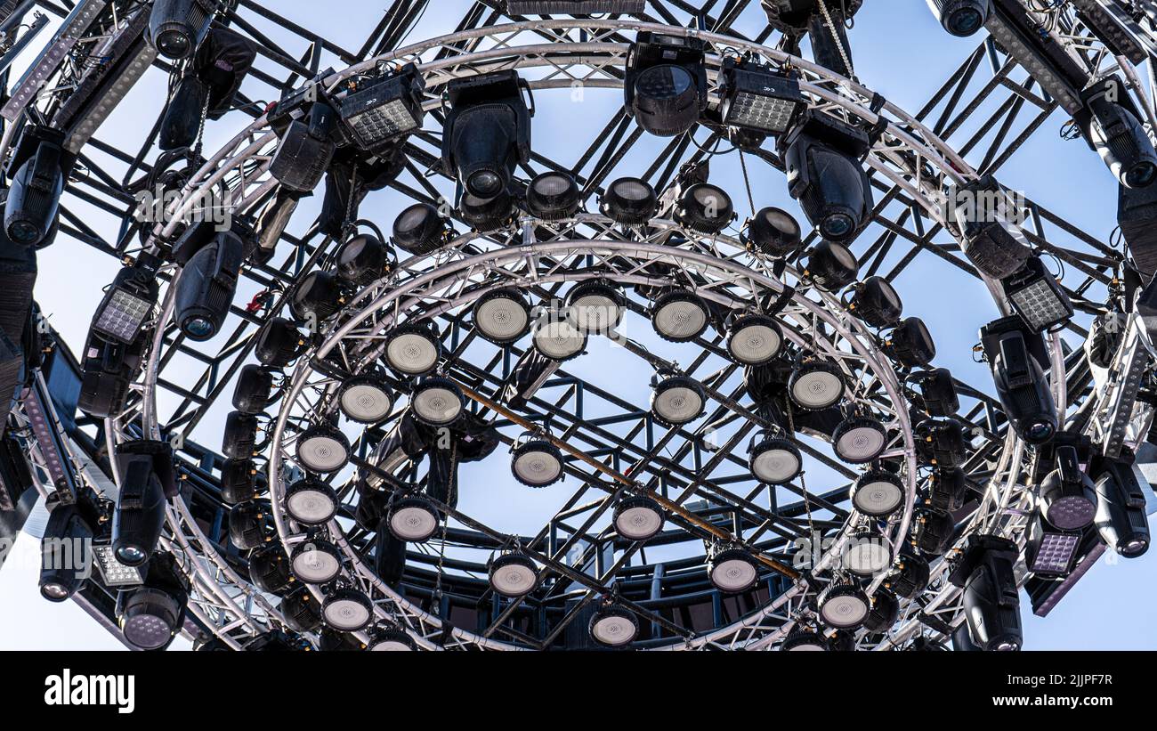 A low angle shot of rotating lighting trusses for outdoor events Stock ...