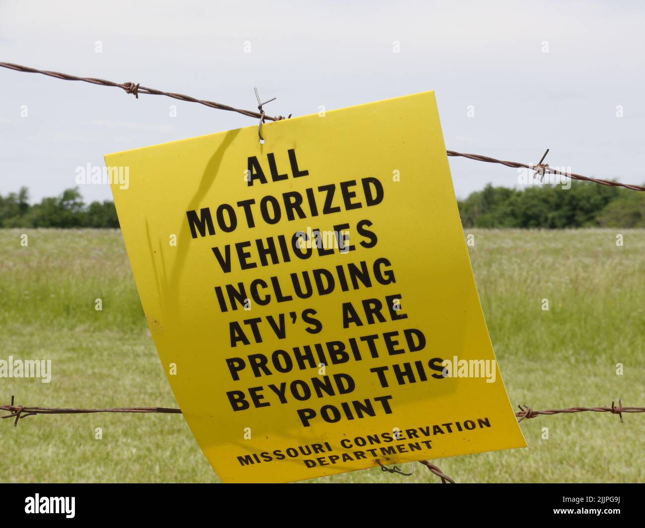 A warning sign prohibiting motorized vehicles on a conservation area ...