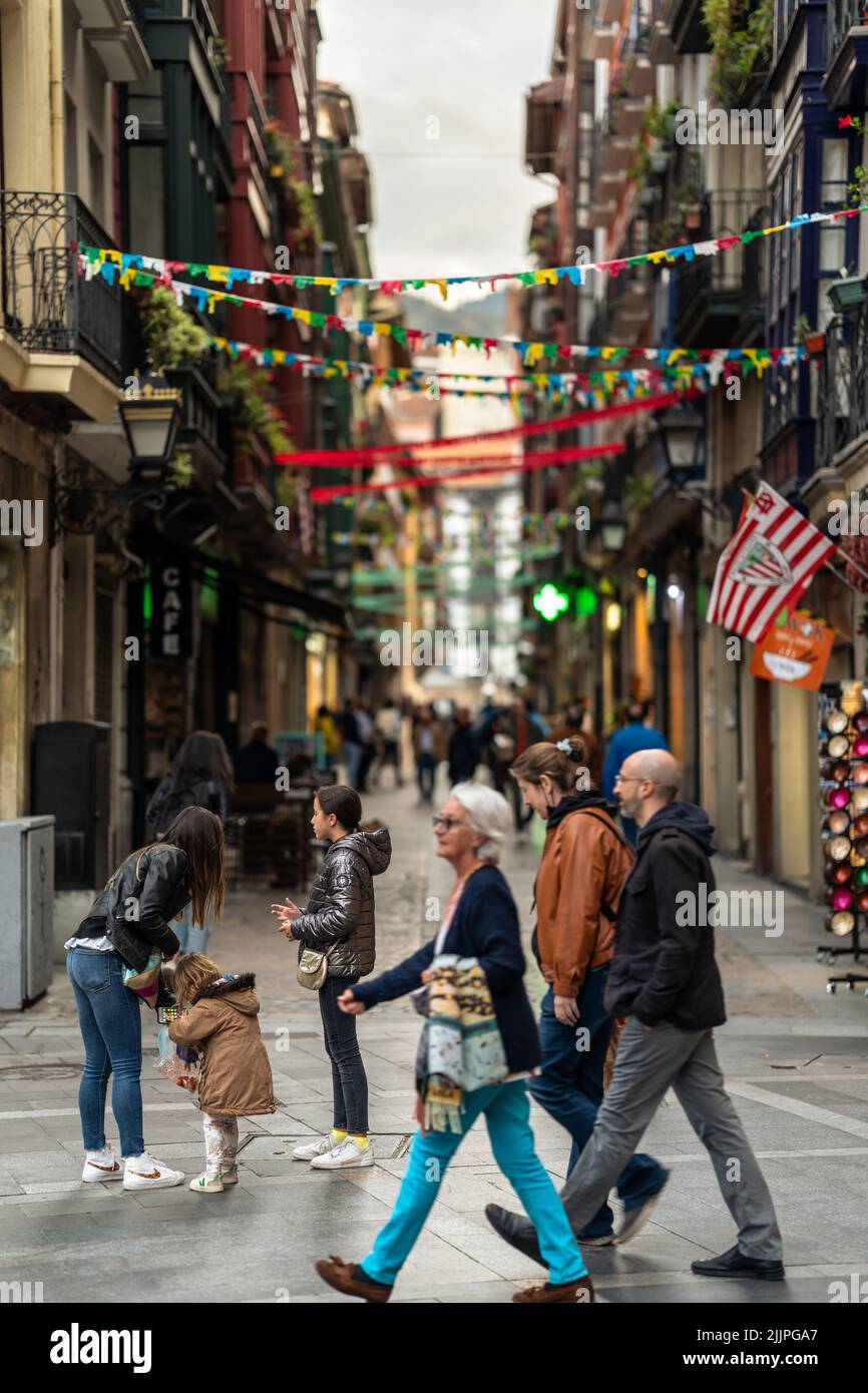 A vertical shot of pedestrians in the busy street of Bilbao in Spain ...
