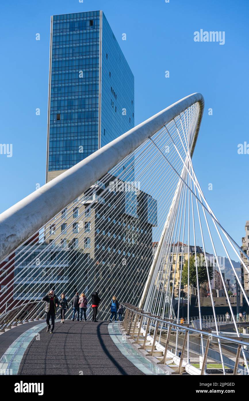 A vertical shot of Zubuzuri footbridge in over the Estuary of Bilbao in ...