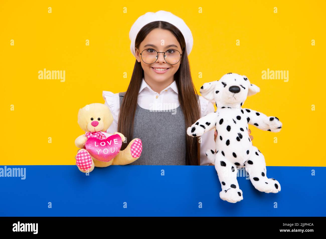 Childhood, toys and kids. Cute teen girl cuddling fluffy toy. Happy ...