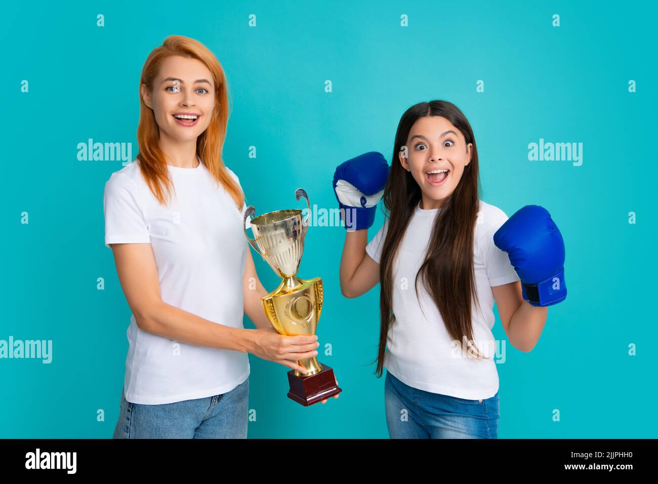 Teenager boxer winner boxing. Mommy and teenager child daughter holding ...