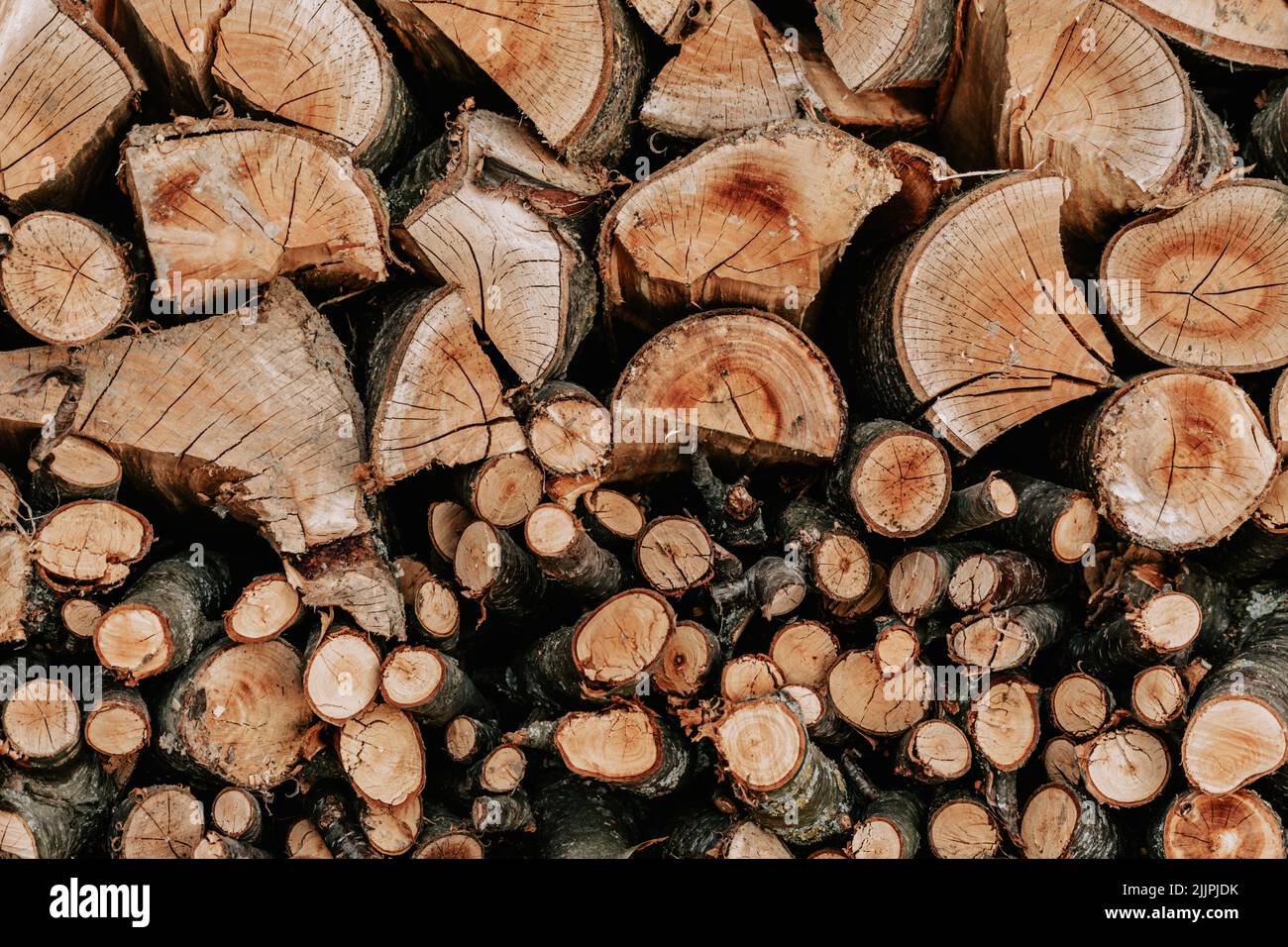 A stack of firewood - perfect for background Stock Photo - Alamy