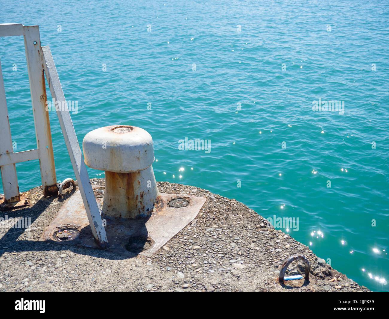 Bollards on the seashore. A place to stop ships. Give mooring line. The ...