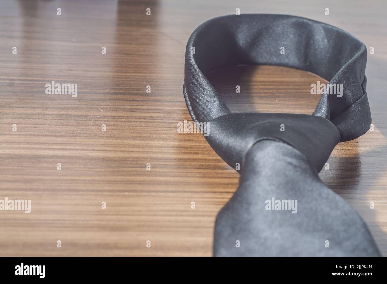 Black tie on a wooden desk with copy space,father's day concept Stock ...