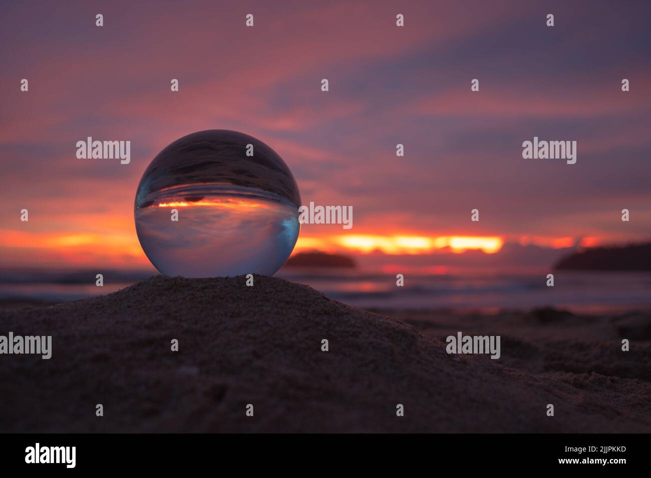 view of beautiful nature at sunset inside crystal ball. stunning sunset ...