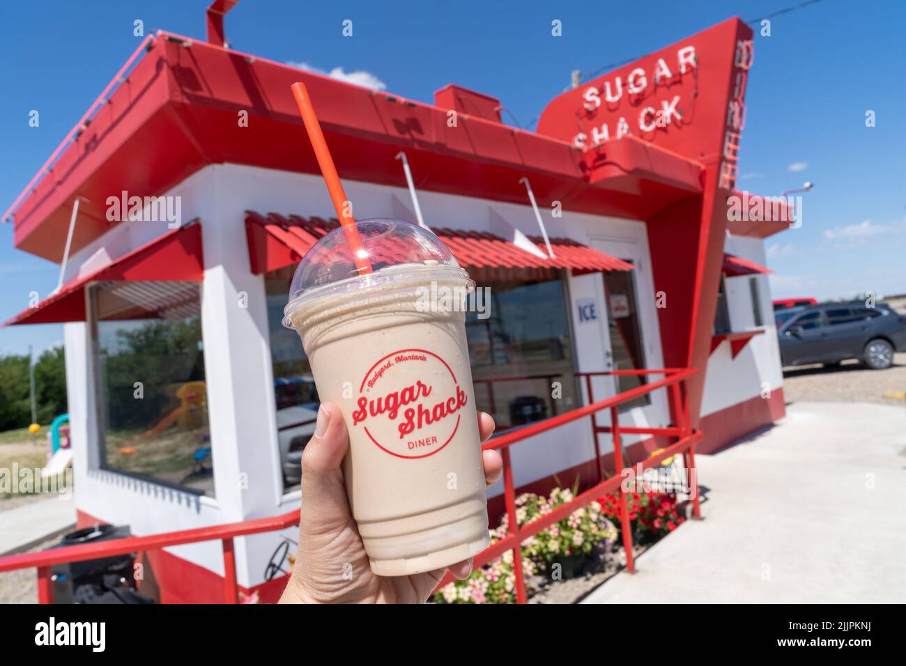 Rudyard, Montana - July 2, 2022: Hand holds up a Sugar Shack diner ...