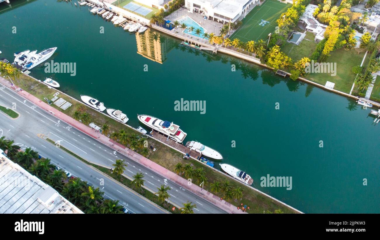 An aerial view of the waterway with berthed boats in Miami at dawn ...