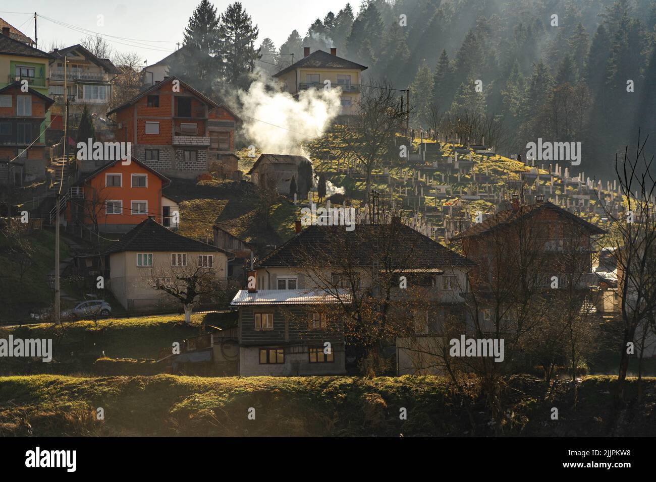 The hillside rural houses in Maglaj, Bosnia surrounded by lush green ...