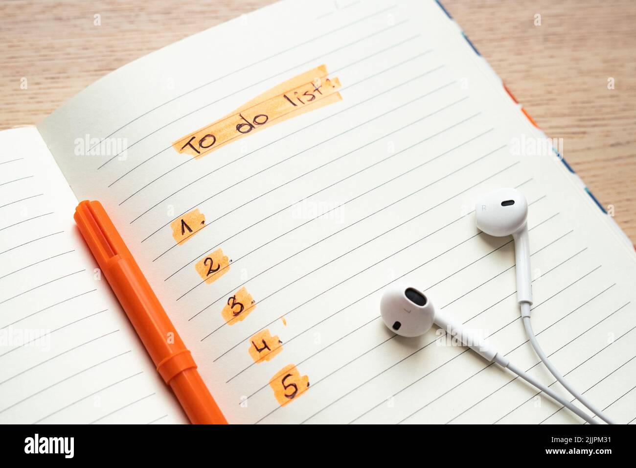 Open notebook To do list, paper, pen, headphones Stock Photo - Alamy