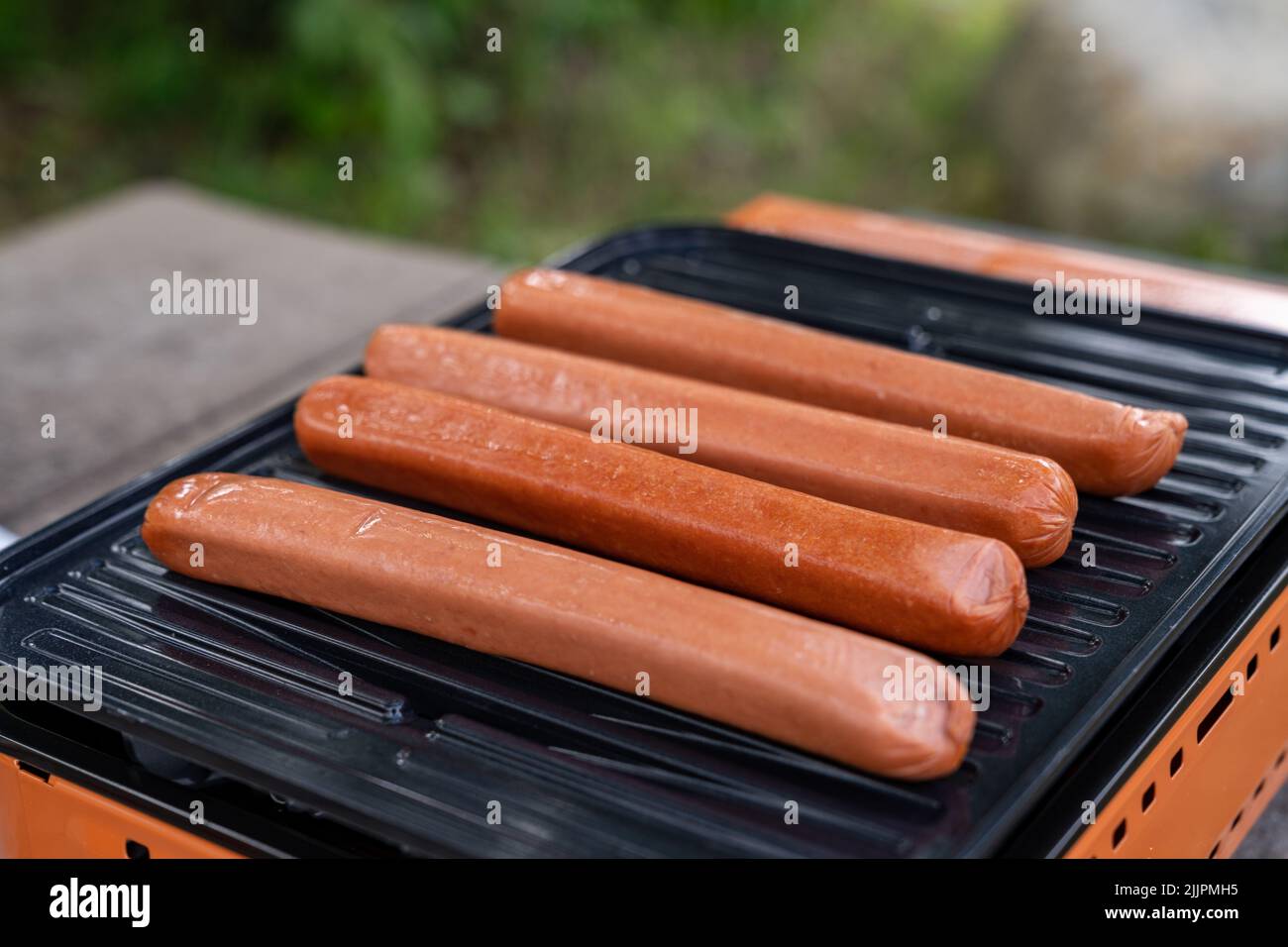Close up roasting hot dog hi-res stock photography and images - Alamy